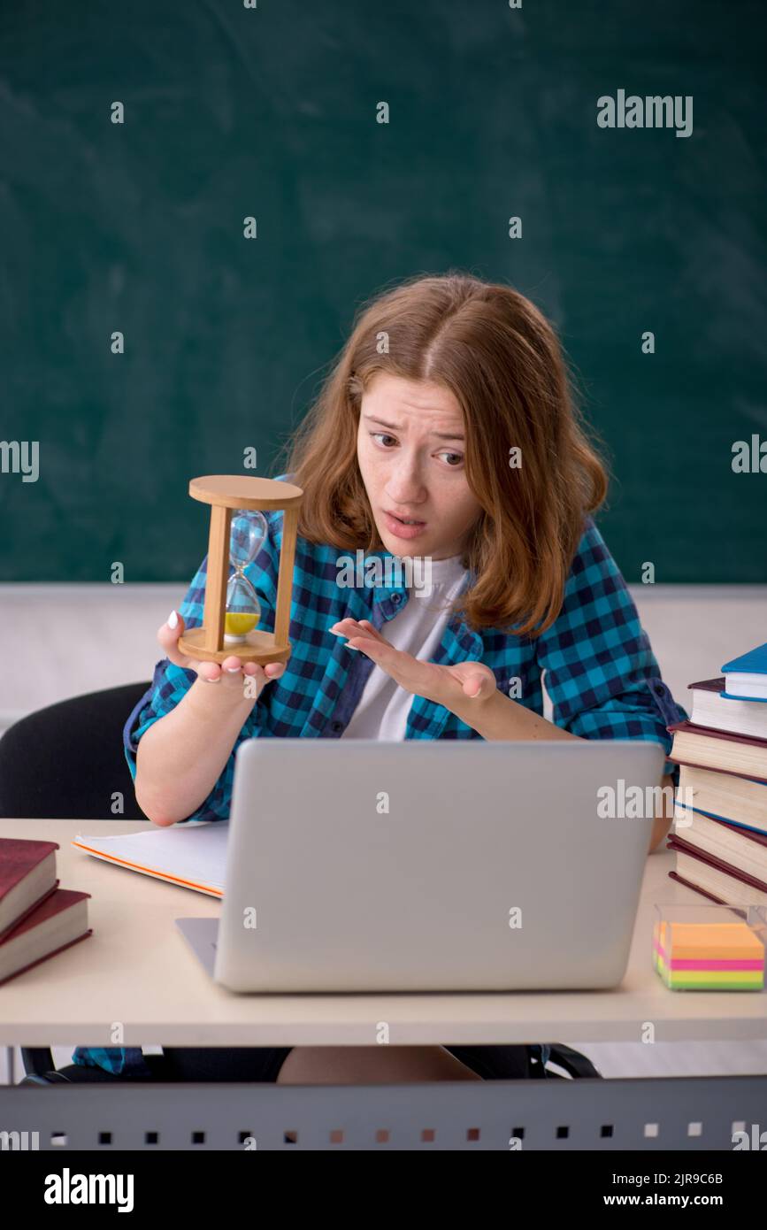 Young girl student in time management concept Stock Photo - Alamy