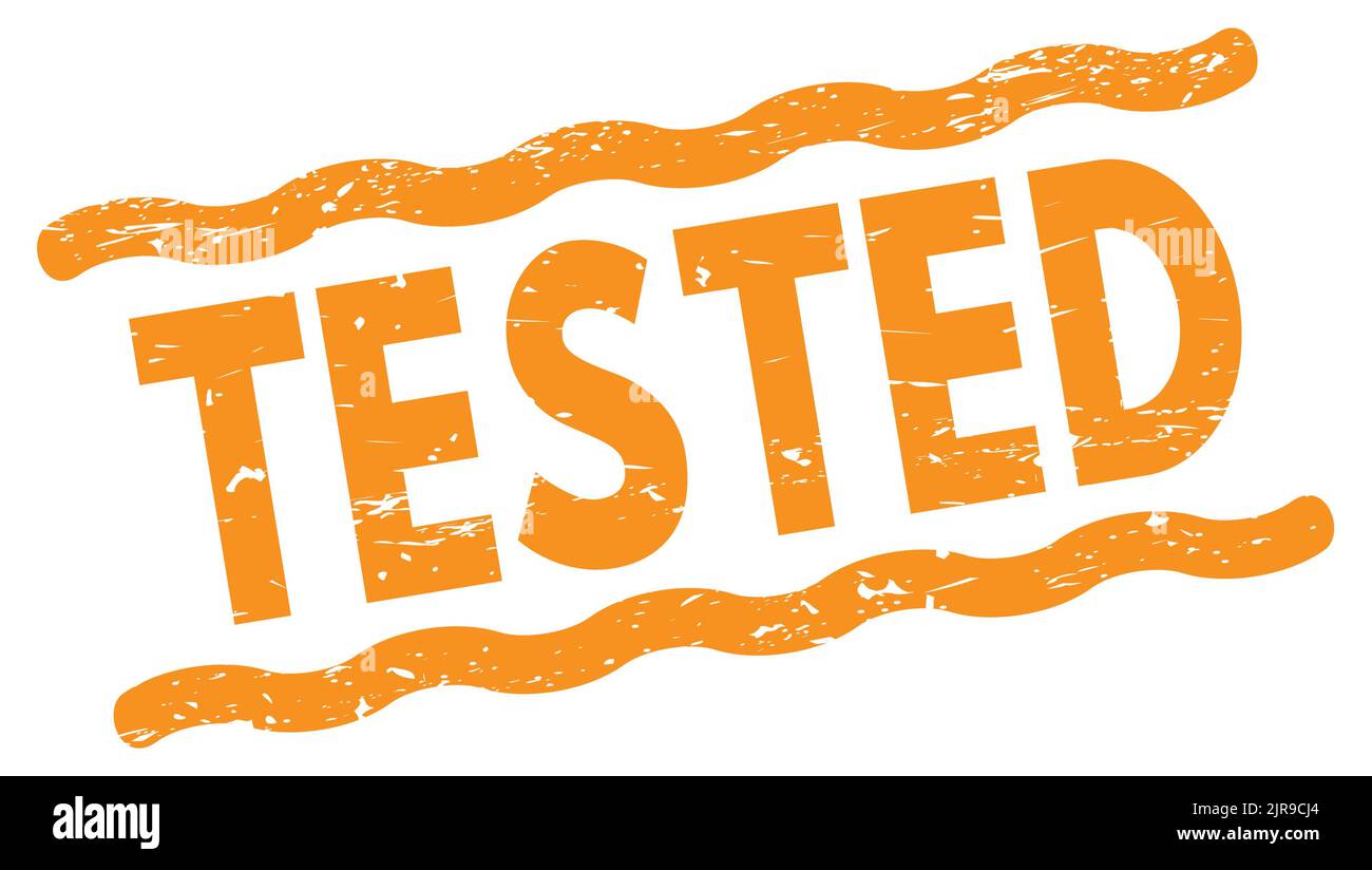 TESTED text written on orange lines stamp sign Stock Photo - Alamy