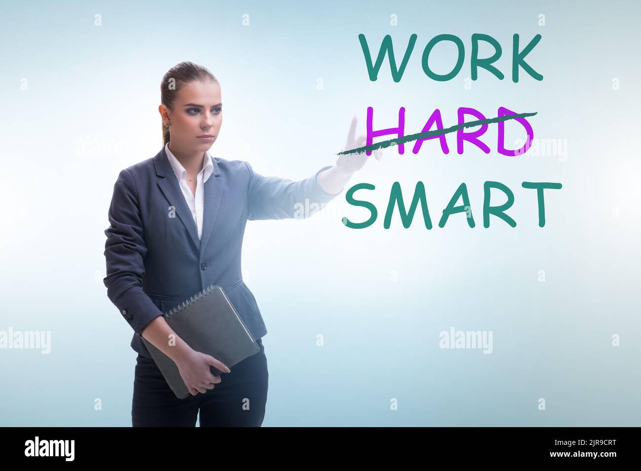 Businesswoman in the working smart not hard concept Stock Photo - Alamy