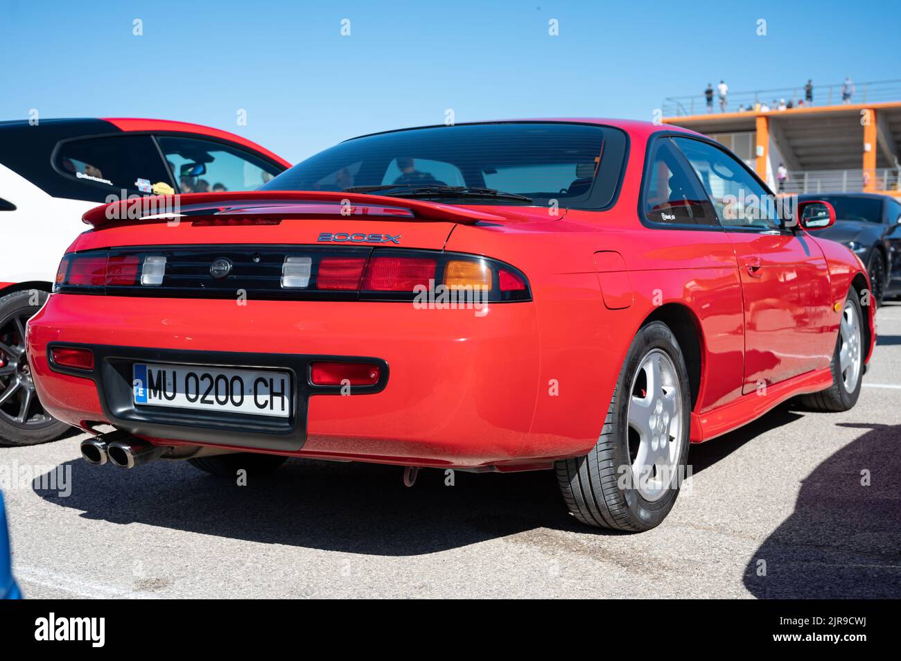 A rear view of a red classic Japanese Nissan Silvia S14 Kouki sports ...