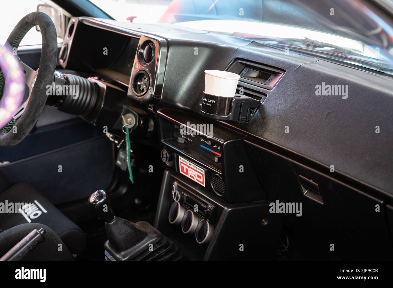 An Interior of Toyota Corolla Sprinter Trueno AE86 with a cup of water ...
