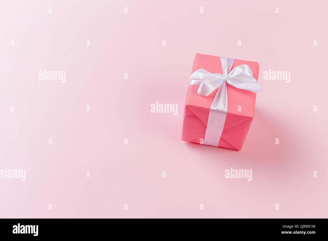 gift box on color background Stock Photo - Alamy