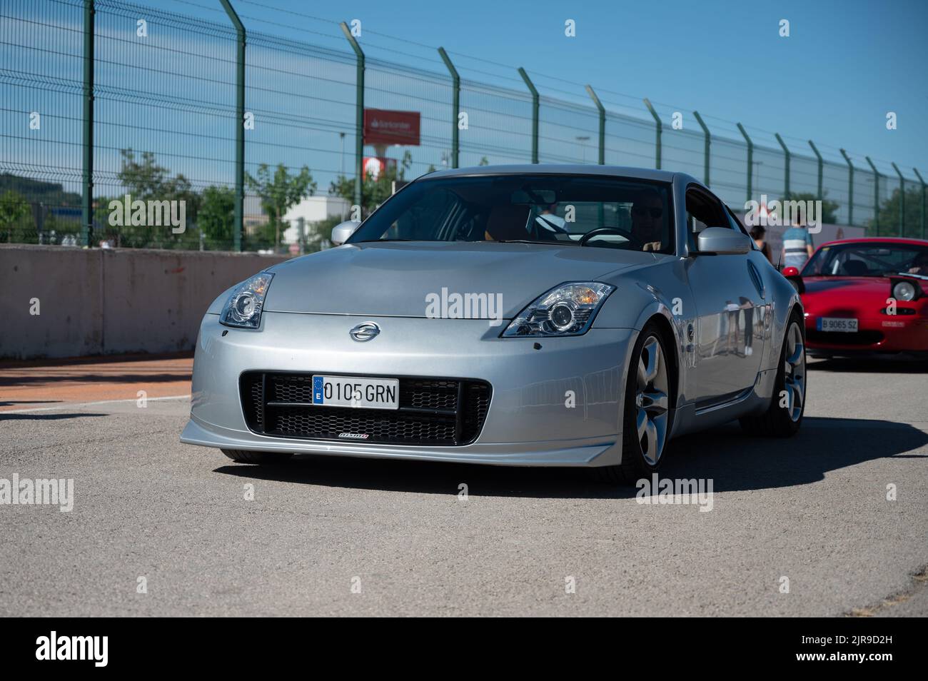 A Japanese silver Nissan 350Z on an asphalt road Stock Photo - Alamy