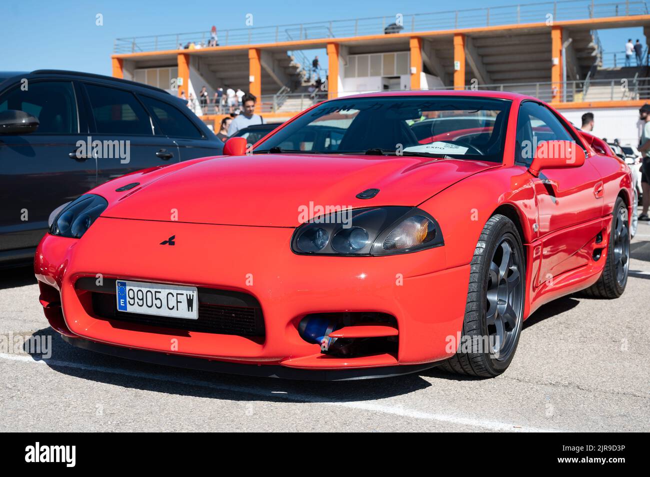 A front view of a red Mitsubishi 3000Gt parked on the street Stock ...