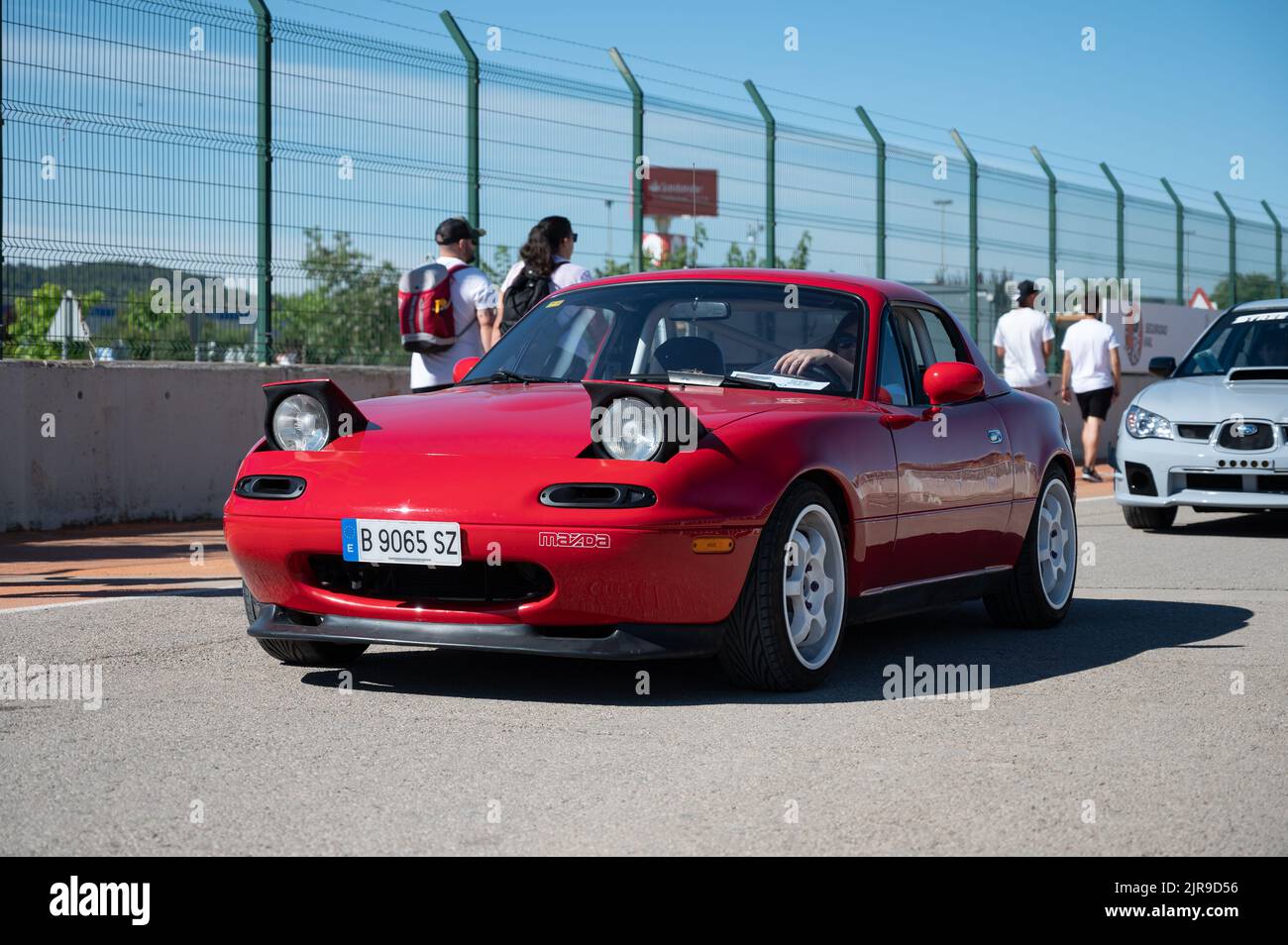 A front view of a red convertible Japanese Mazda Mx-5 Miata sports car ...