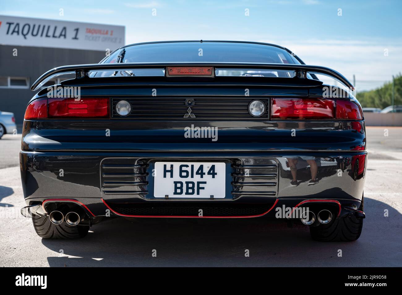 A rear view of a black Mitsubishi 3000Gt parked on the street Stock ...