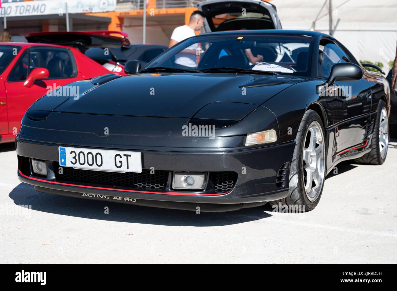A front view of a black Mitsubishi 3000Gt parked on the street Stock ...