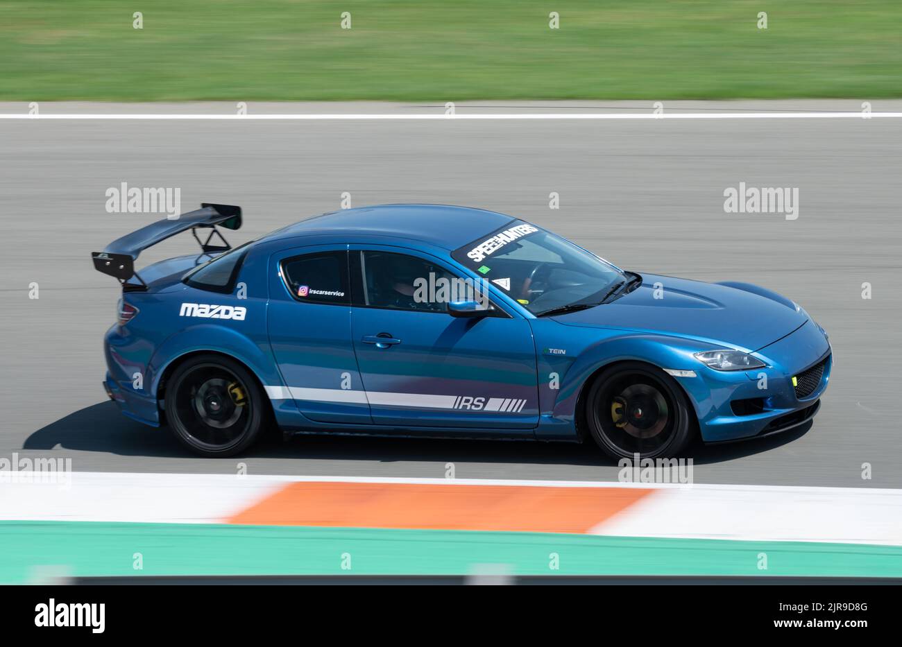 A blue Japanese Mazda RX-8 sports car on a race track Stock Photo - Alamy