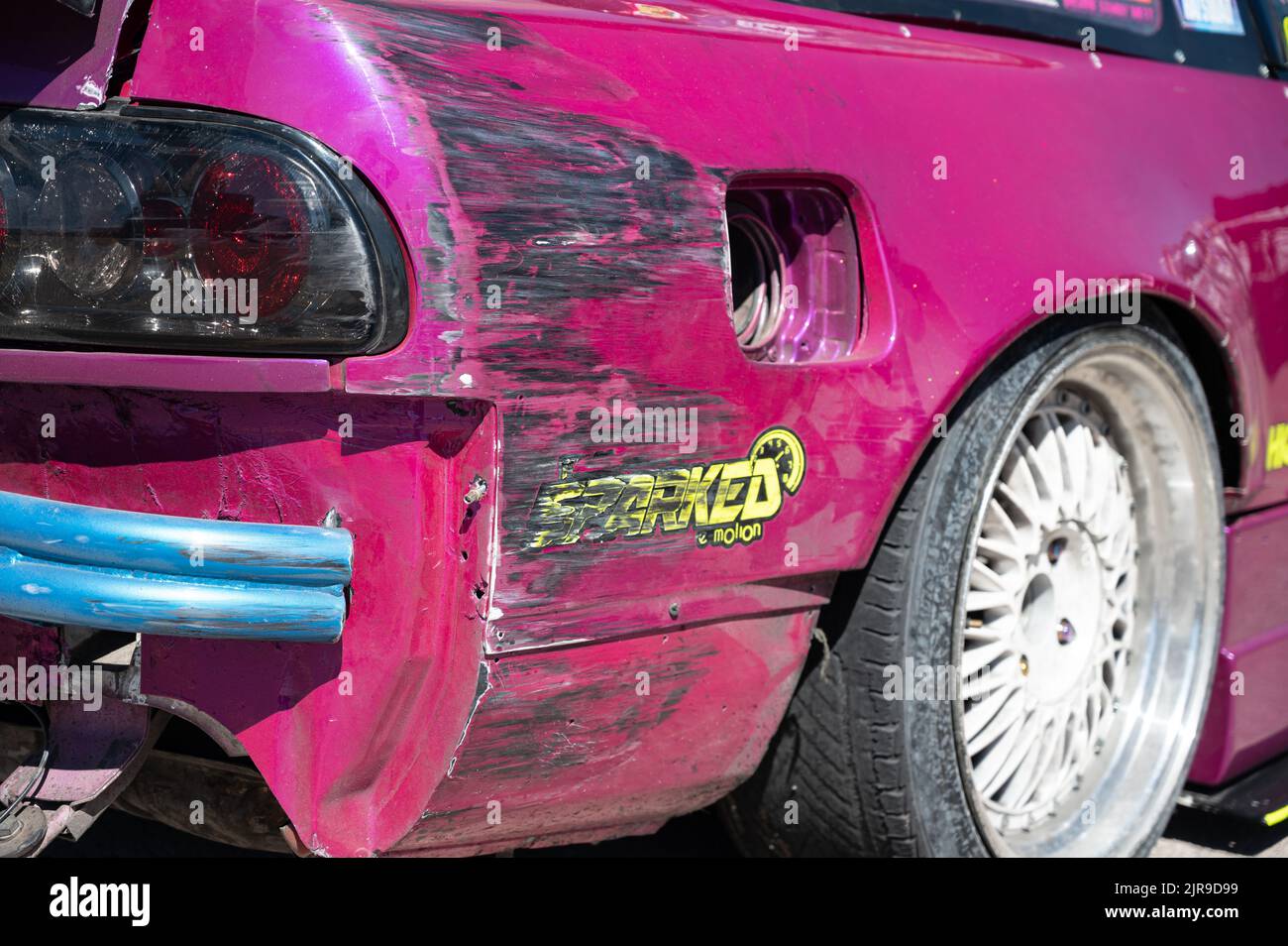 A rear view of the bumps and scratches of a purple Nissan Silvia S13 ...