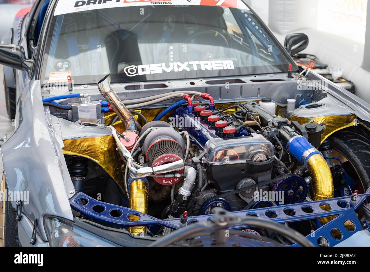 The engine of silver Nissan Silvia S13 5 with an open hood Stock Photo ...
