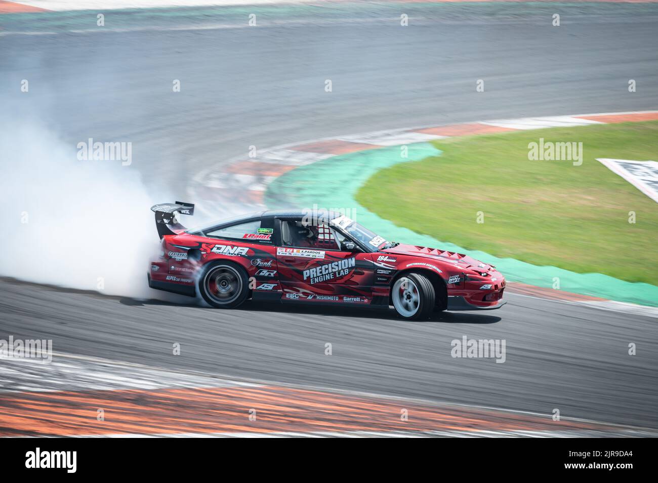 A red Nissan Silvia S13 skidding on a race track Stock Photo - Alamy