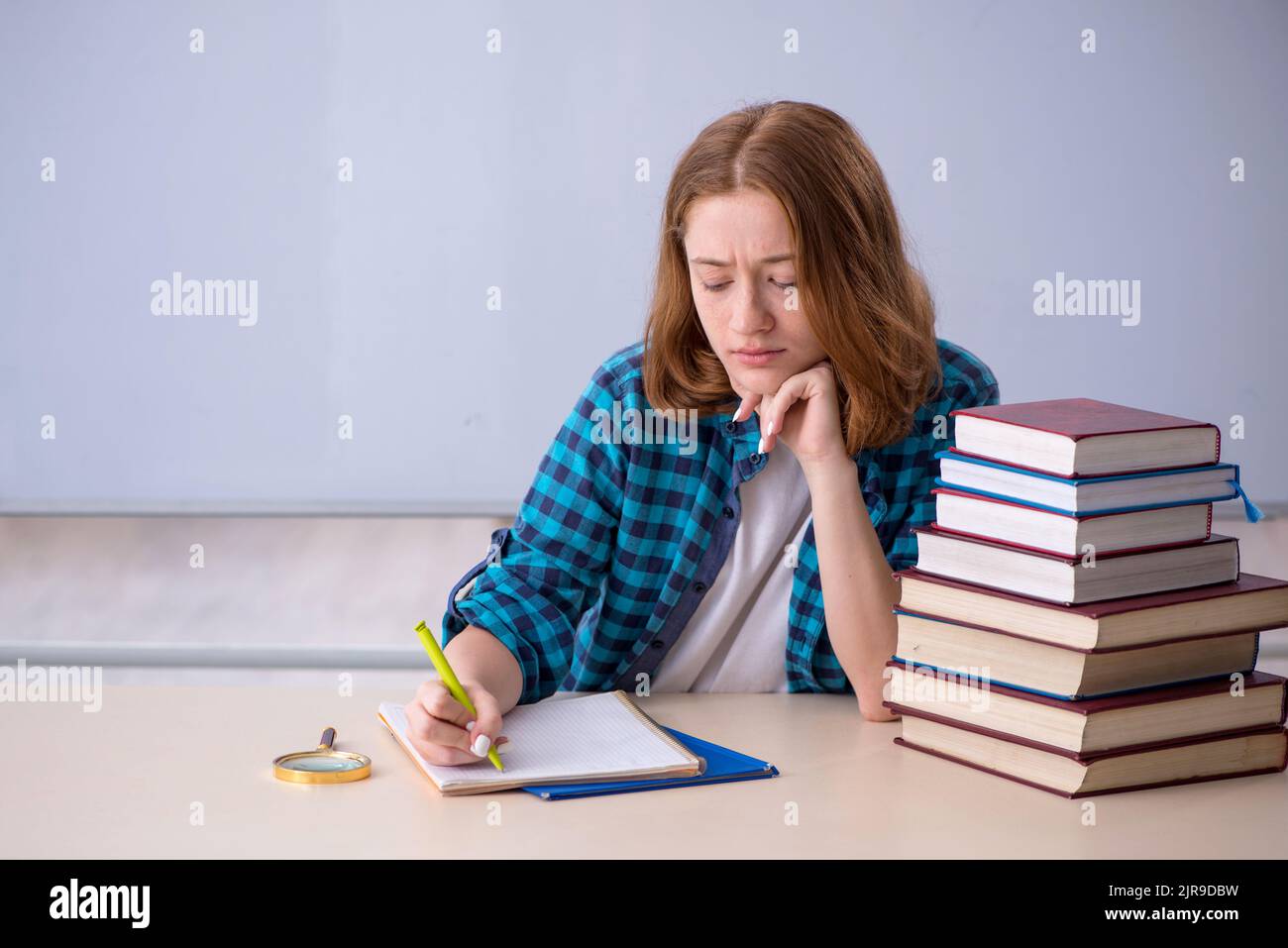 Young girl student preparing for exams in the classroom Stock Photo - Alamy