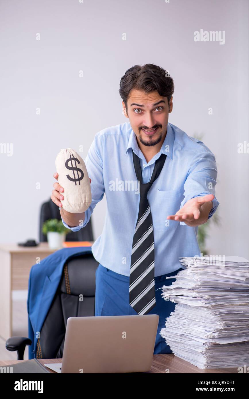 Young businessman employee in remuneration concept Stock Photo - Alamy