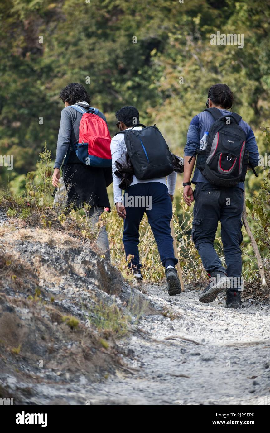 January 1st 2020 Uttarakhand INDIA. Hikers with backpacks and sticks ...
