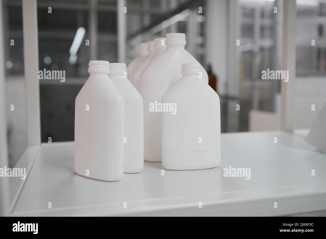 Chemicals in containers on table at laboratory Stock Photo - Alamy