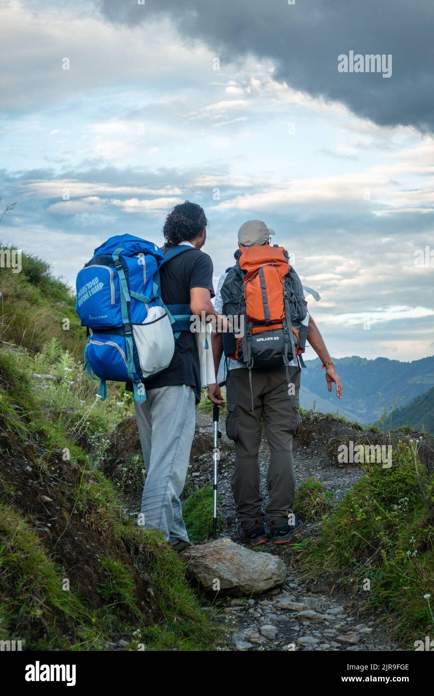 September 9th 2021 Uttarakhand INDIA. Hikers with backpacks and walking ...