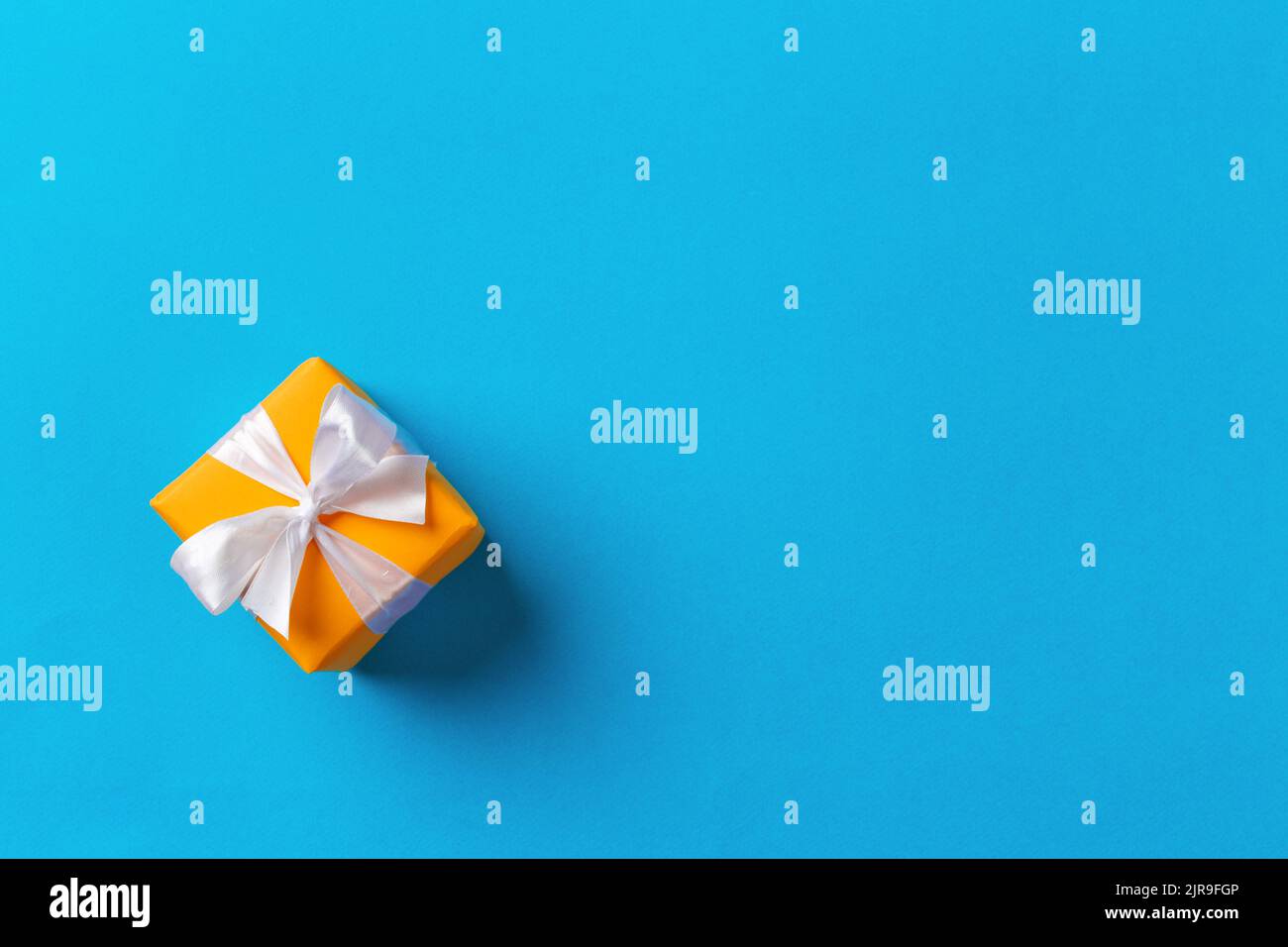 gift box on color background Stock Photo - Alamy