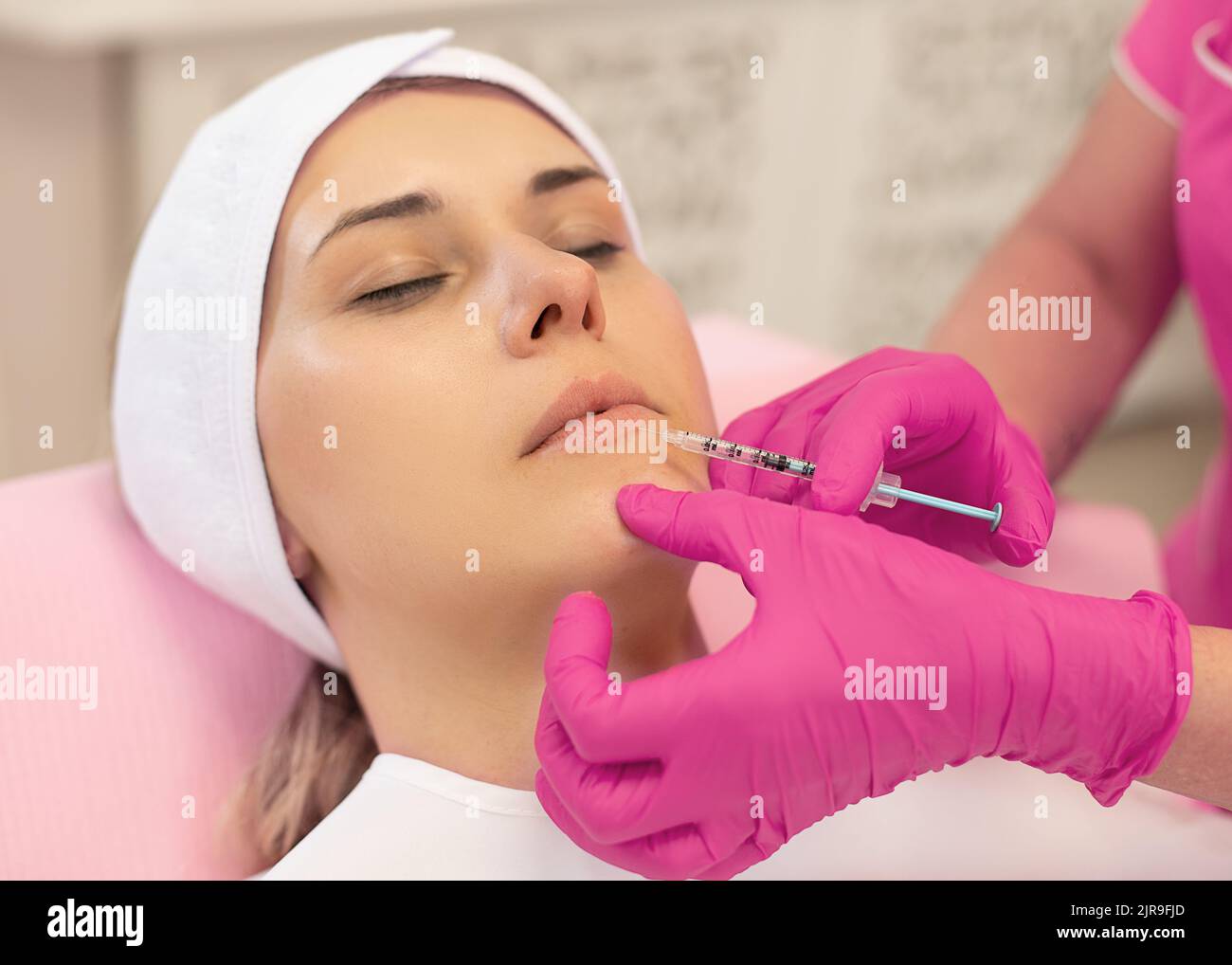 Top view of young woman lying on couch with closed eyes getting ...