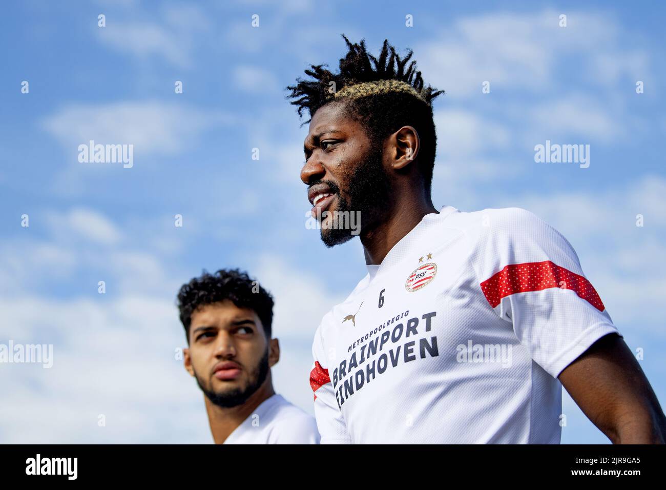 EINDHOVEN - Ibrahim Sangare, Ismail Saibari walk to the training field ...
