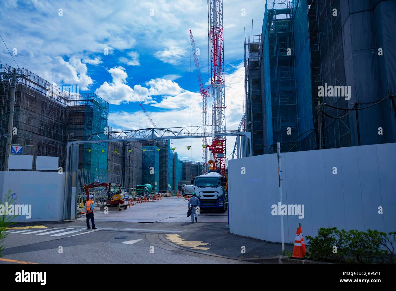 Cranes at the under construction daytime wide shot Stock Photo - Alamy