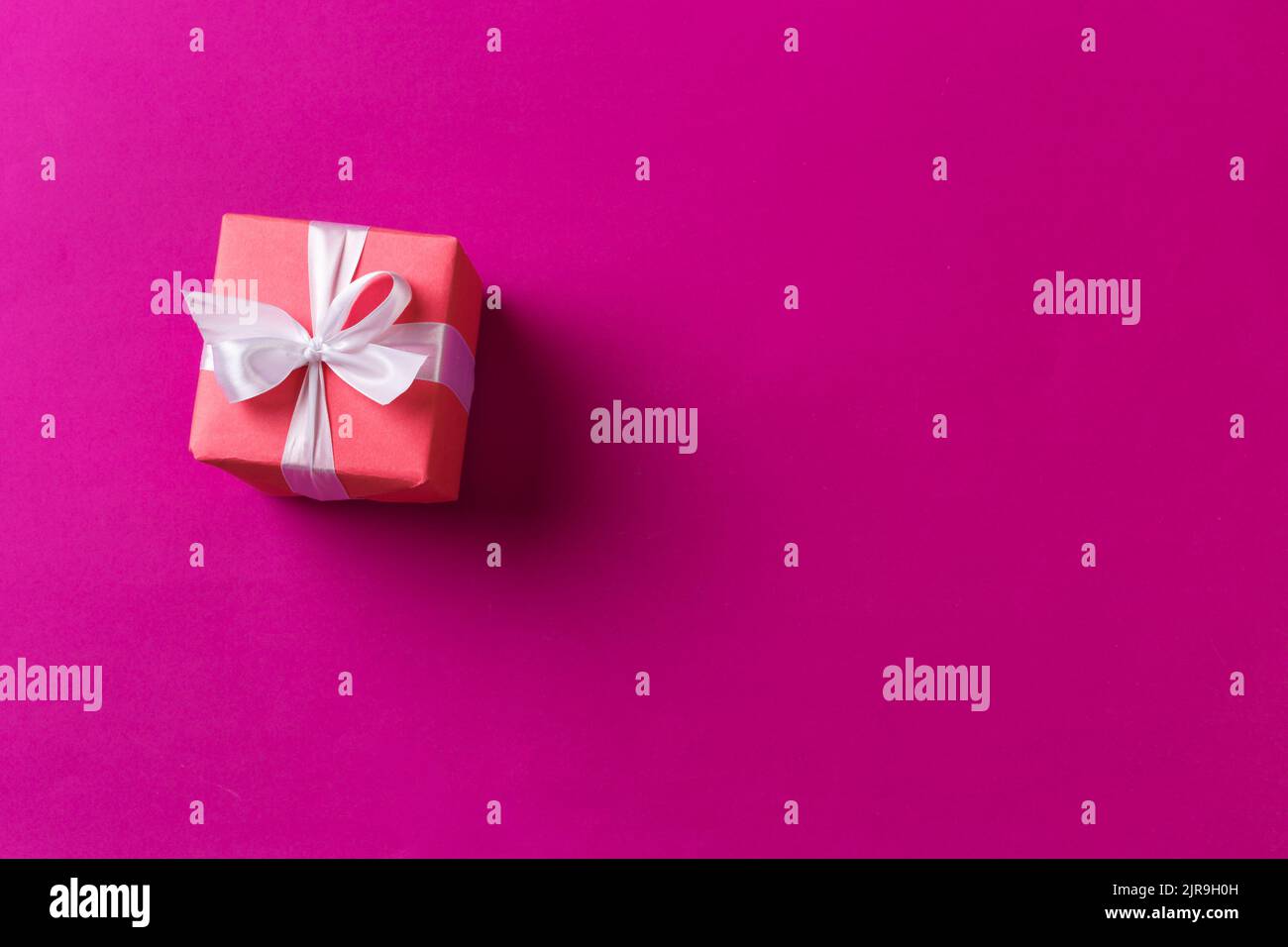 gift box on color background Stock Photo - Alamy