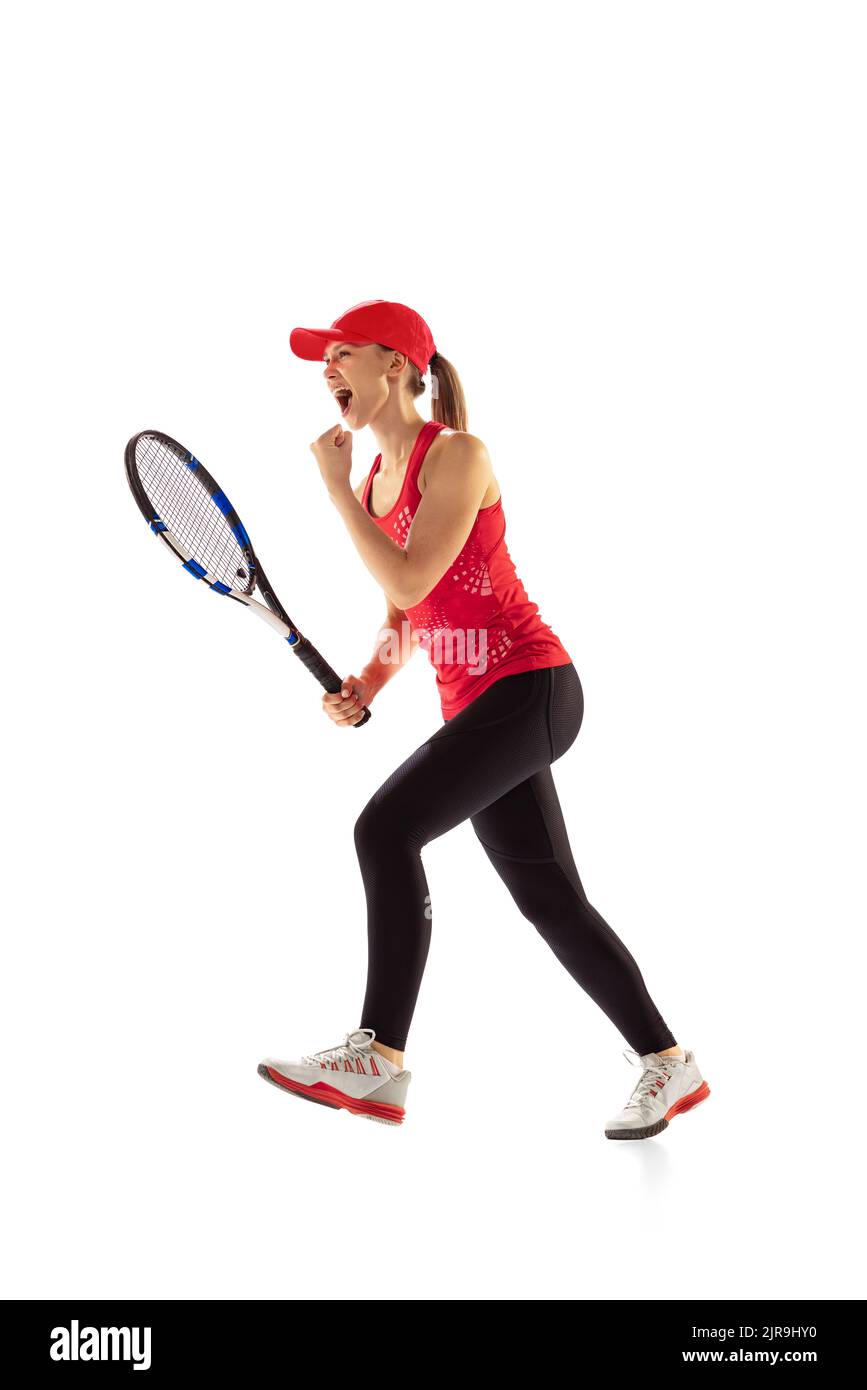 Excited young woman, tennis player shouting after sports win isolated ...