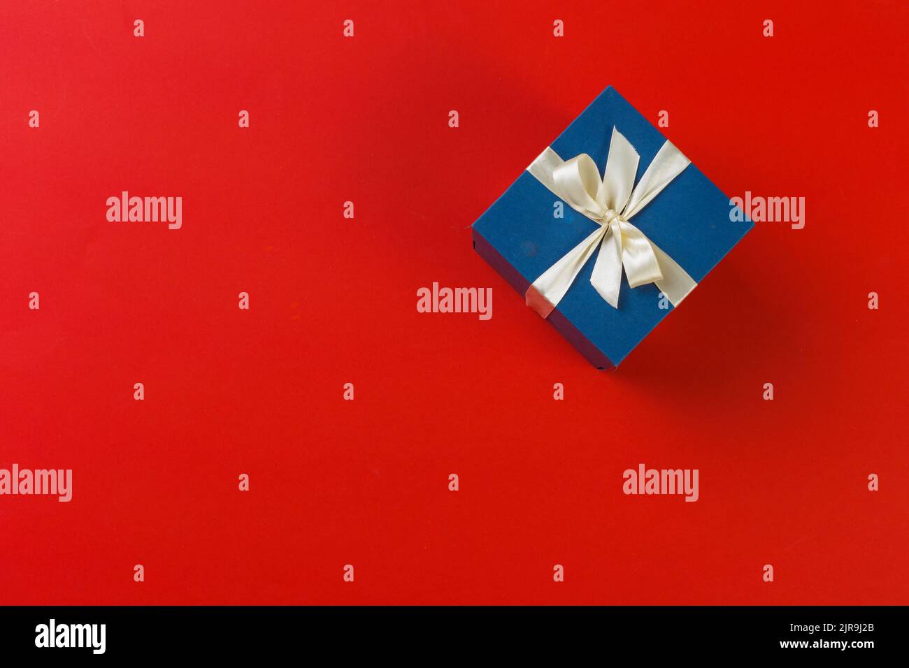 gift box on color background Stock Photo - Alamy