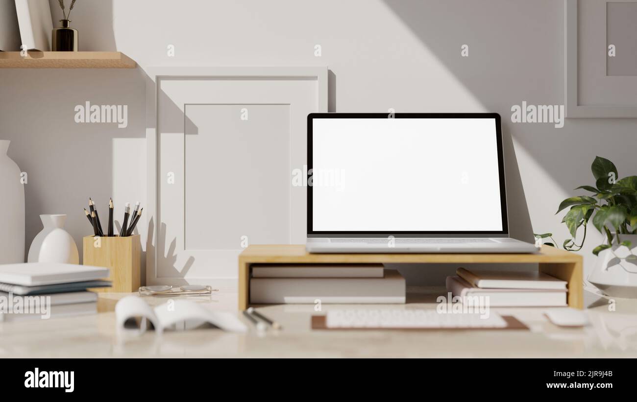 close-up image, Modern white workspace with laptop white screen mockup ...