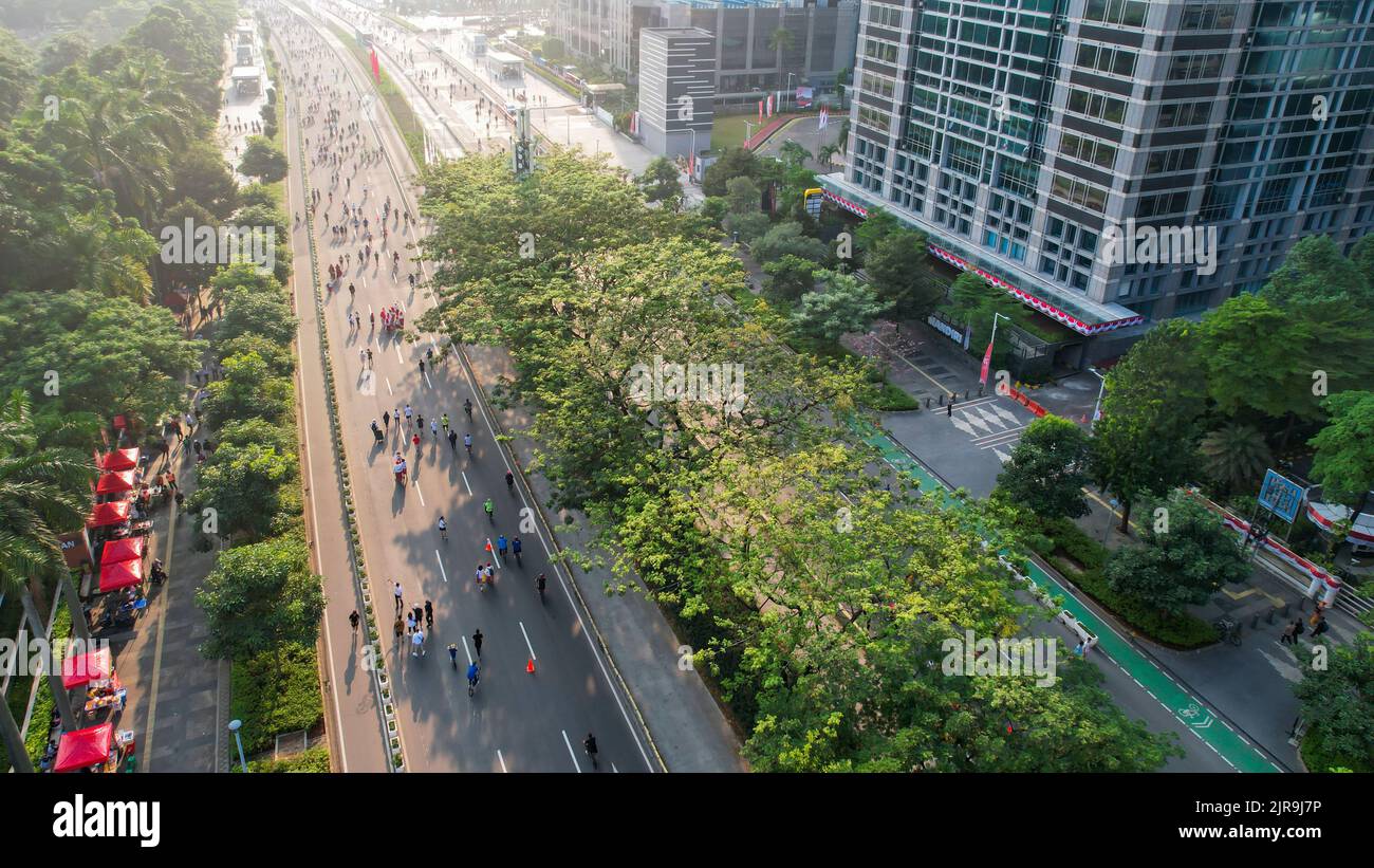 Aerial view of the A crowd of people enjoy Sunday morning near Bunderan ...