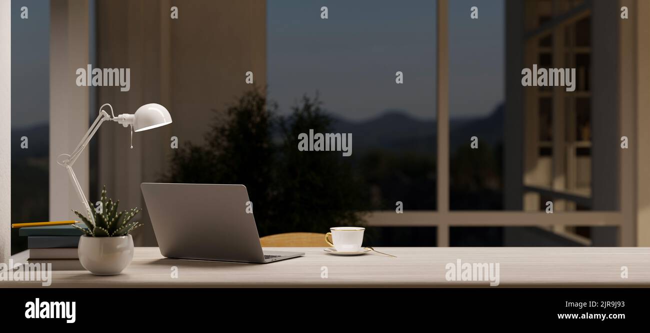 Modern office building room in the evening with laptop computer, table ...