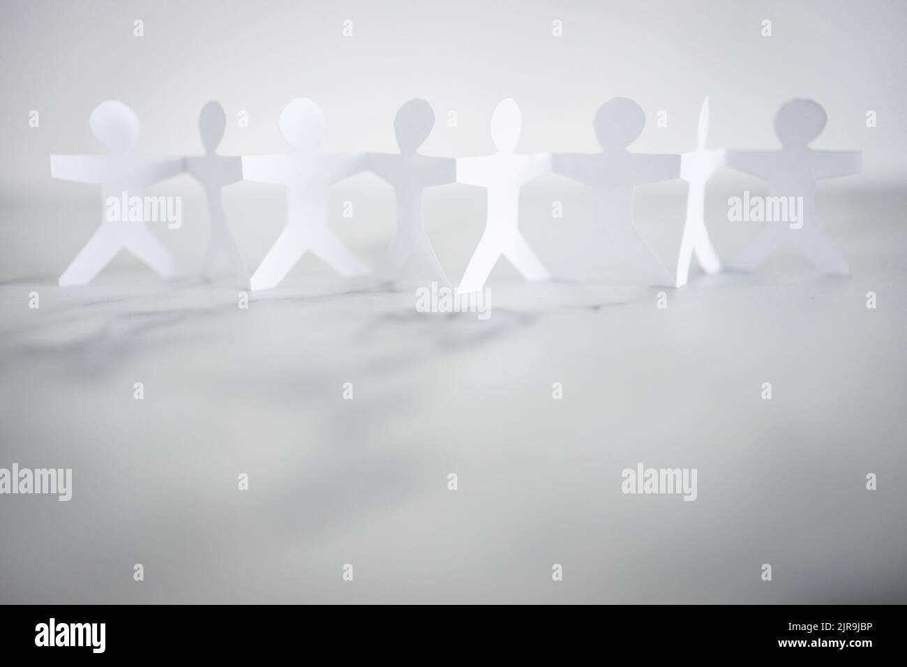 manpower and teamwork conceptual image, paper people chain with text on ...