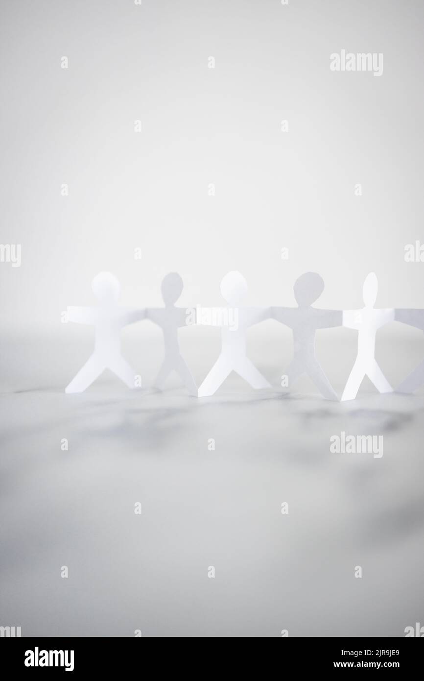 manpower and teamwork conceptual image, paper people chain with text on ...