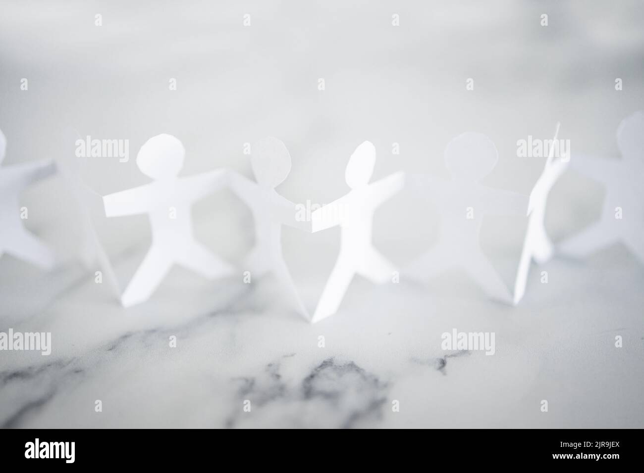 manpower and teamwork conceptual image, paper people chain with text on ...