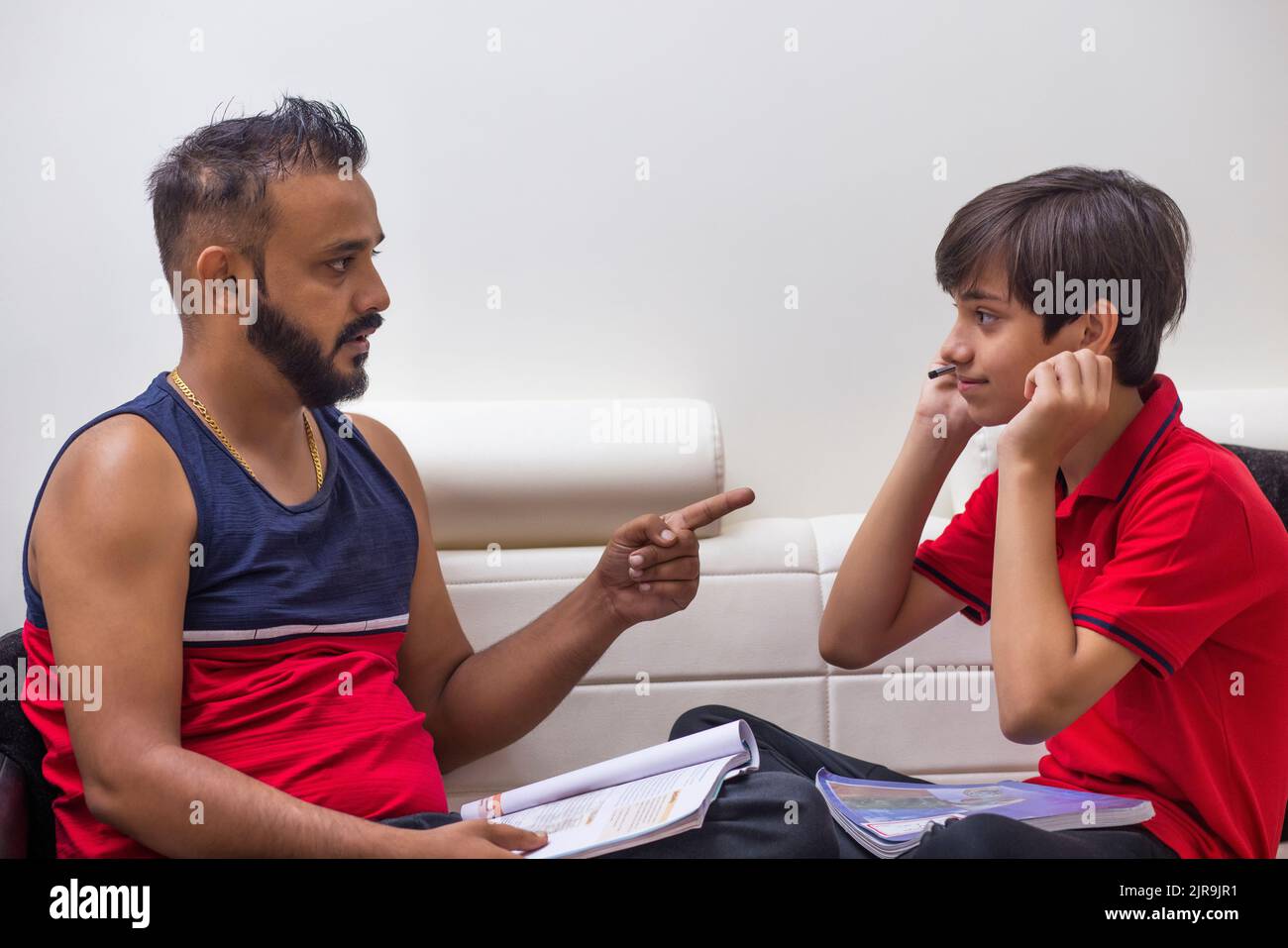 Young boy apologizing to his father for the mistake Stock Photo - Alamy