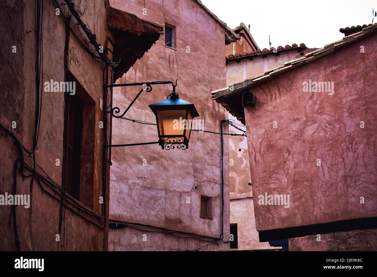 Old iron lamppost in a street of the medieval town of Albarracin Stock ...
