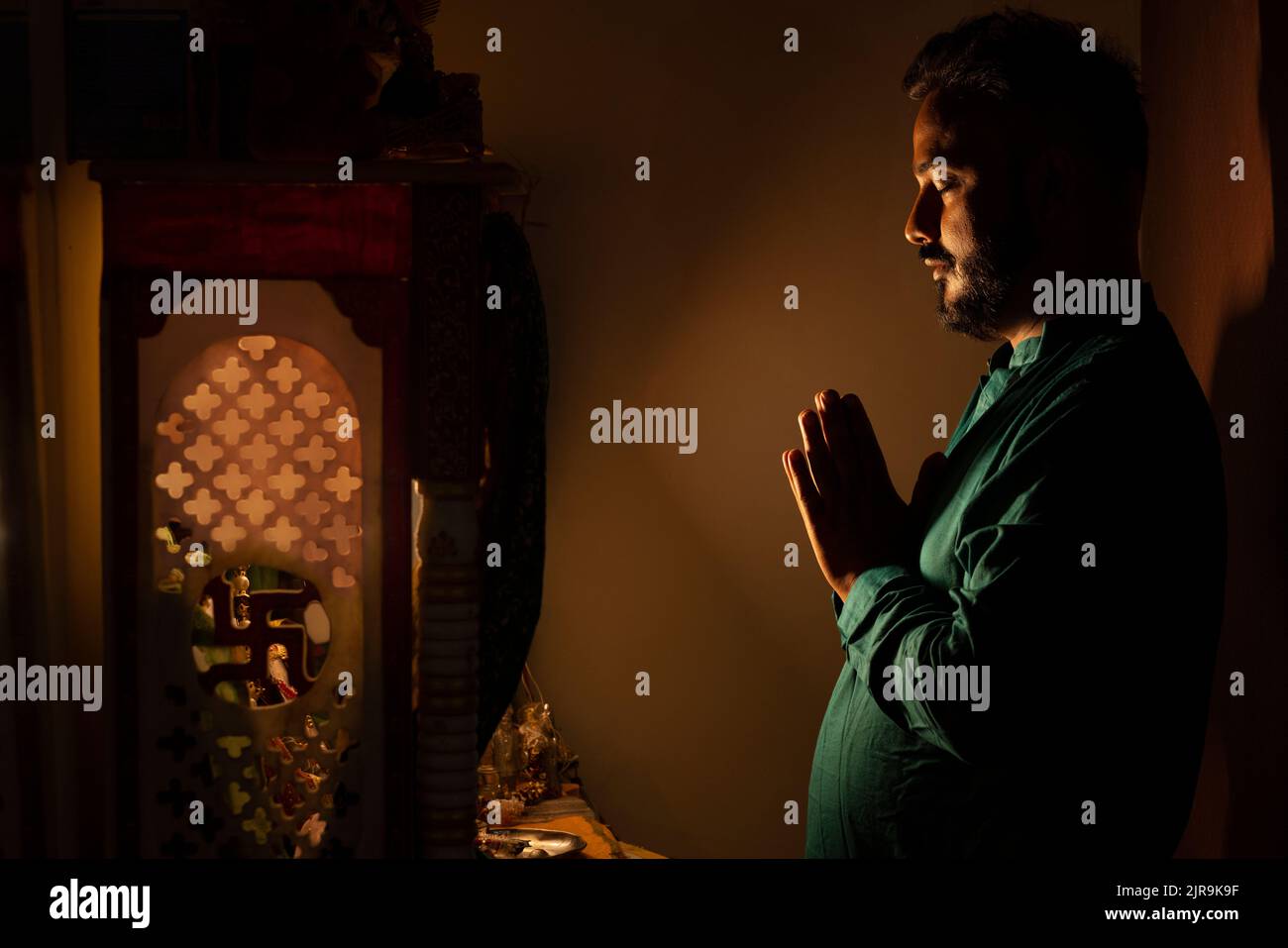 Portrait of man praying to God with folded hands Stock Photo - Alamy