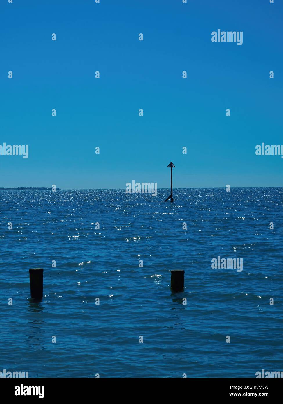 A minimalist seascape, with the silhouette of a market and a near ...