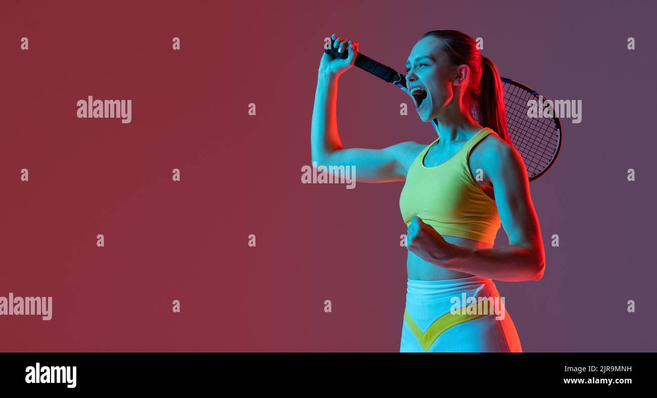 Excited young woman, tennis player shouting after sports win isolated ...