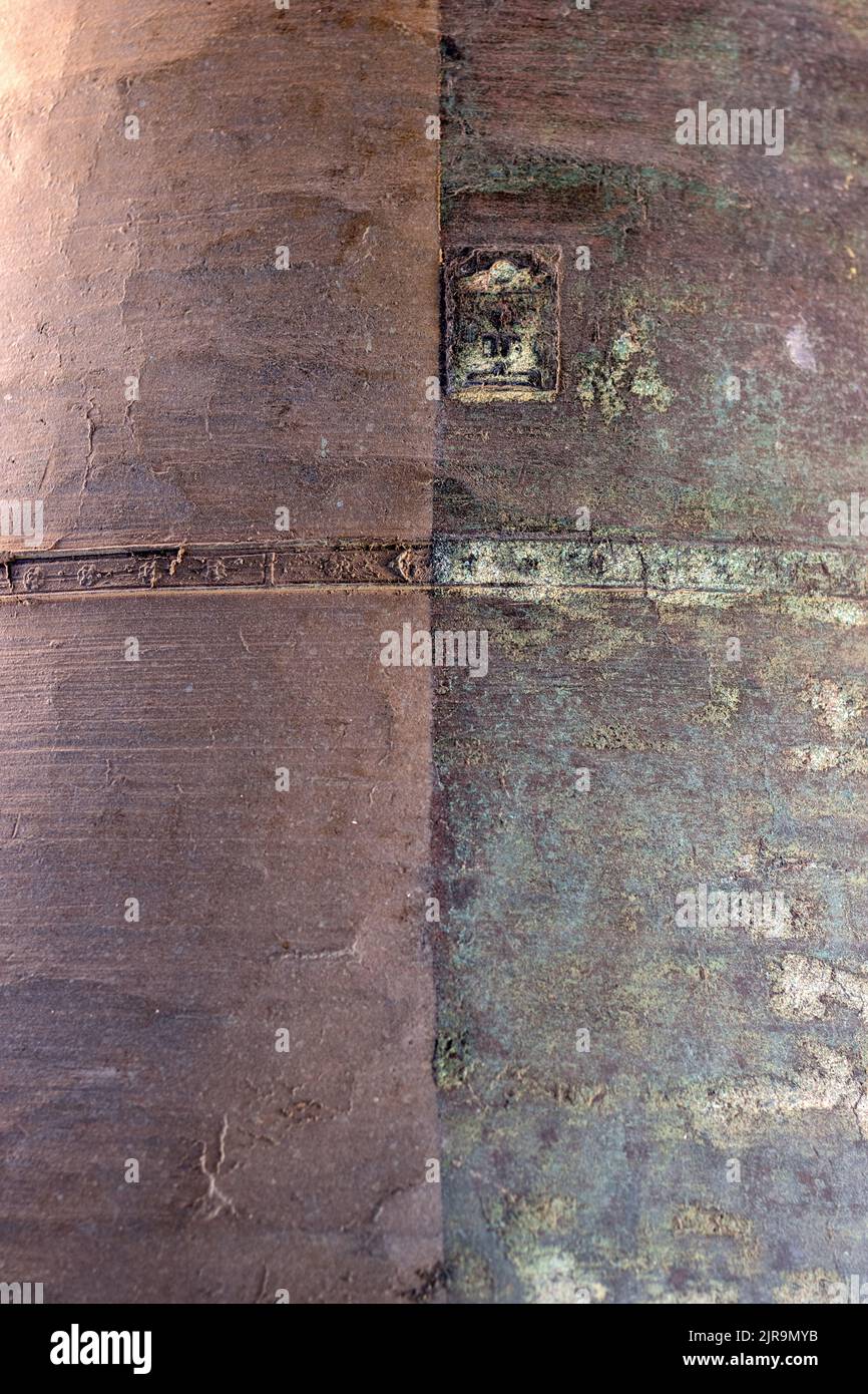 Close-up of an old church bell. Metal forged in the old fashioned way ...