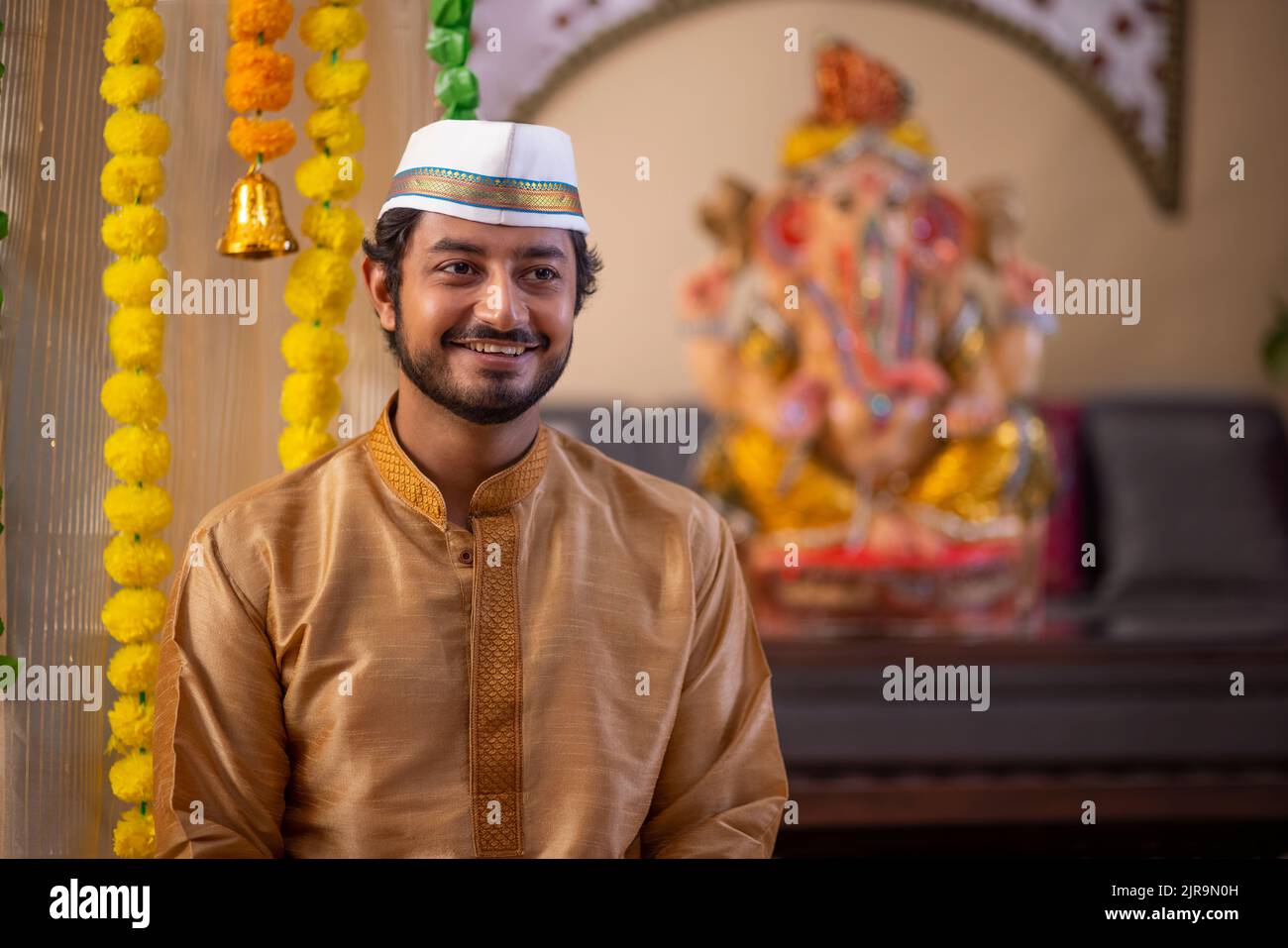 Portrait of a happy Maharashtrian man in traditional outfit on Ganesh ...