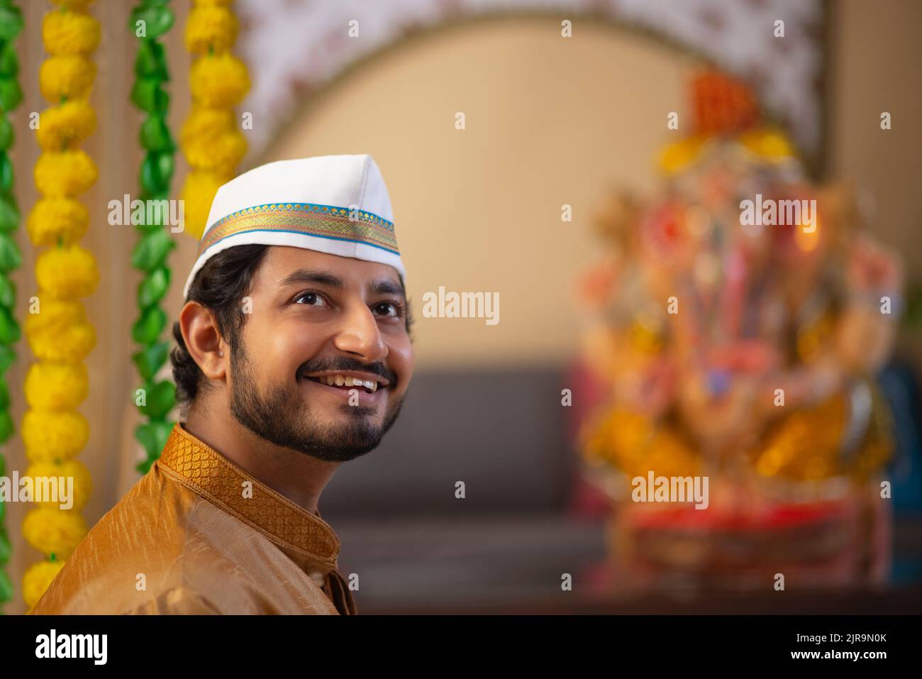 Portrait of a happy Maharashtrian man in traditional outfit on Ganesh ...