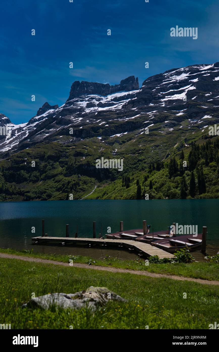 A wooden small bridge in the lake with the mountain background Stock ...