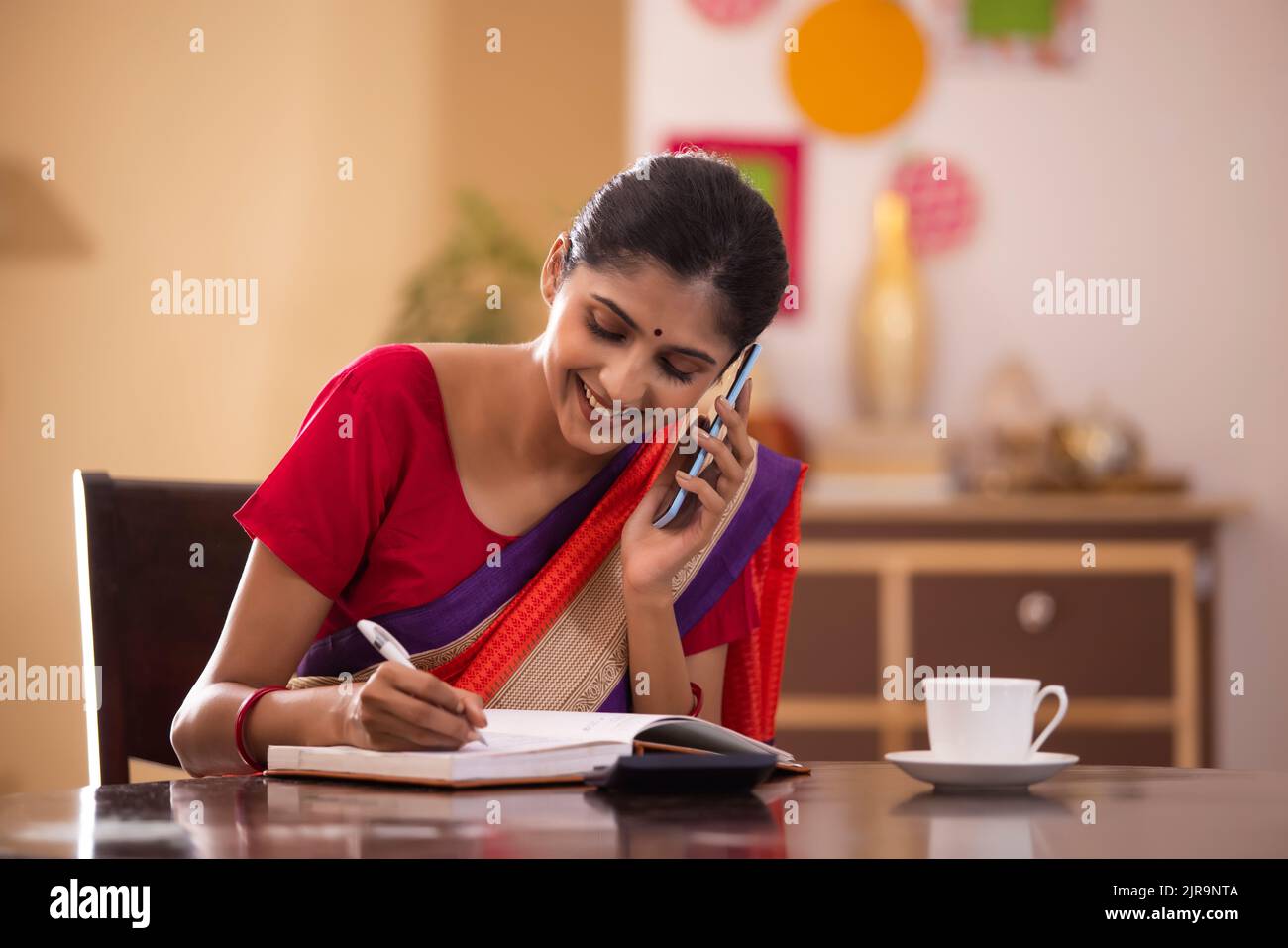 Asian woman taking notes on hi-res stock photography and images - Alamy