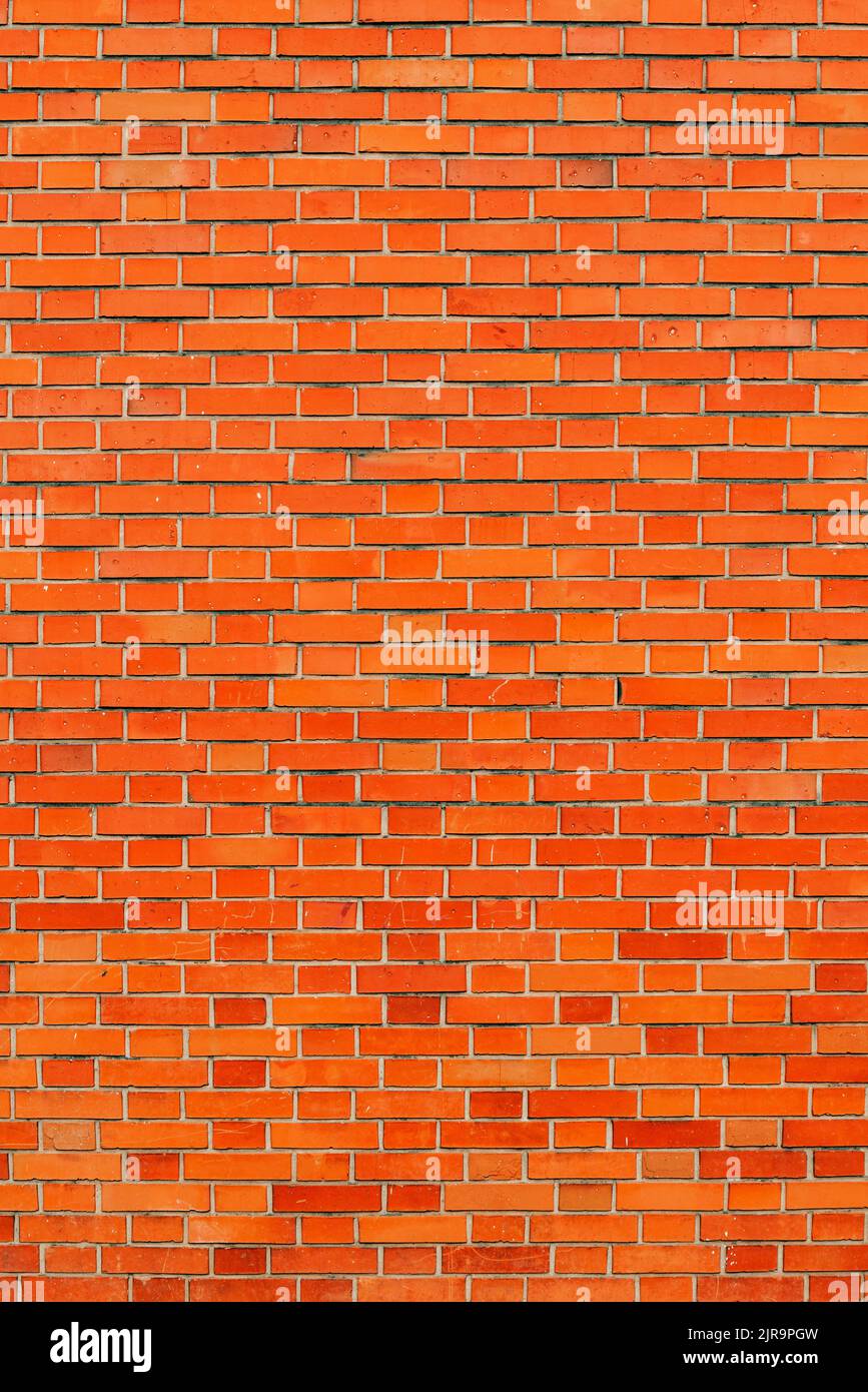 Red brick wall background. Vertical shot of brickwork pattern as ...