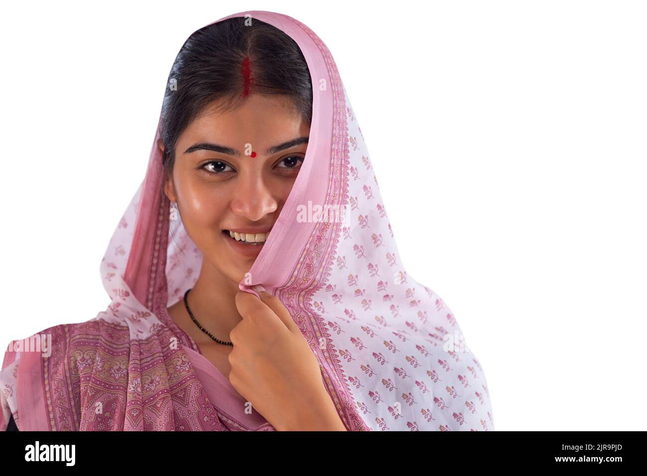 Close-up portrait of a smiling Bihar woman against white background ...