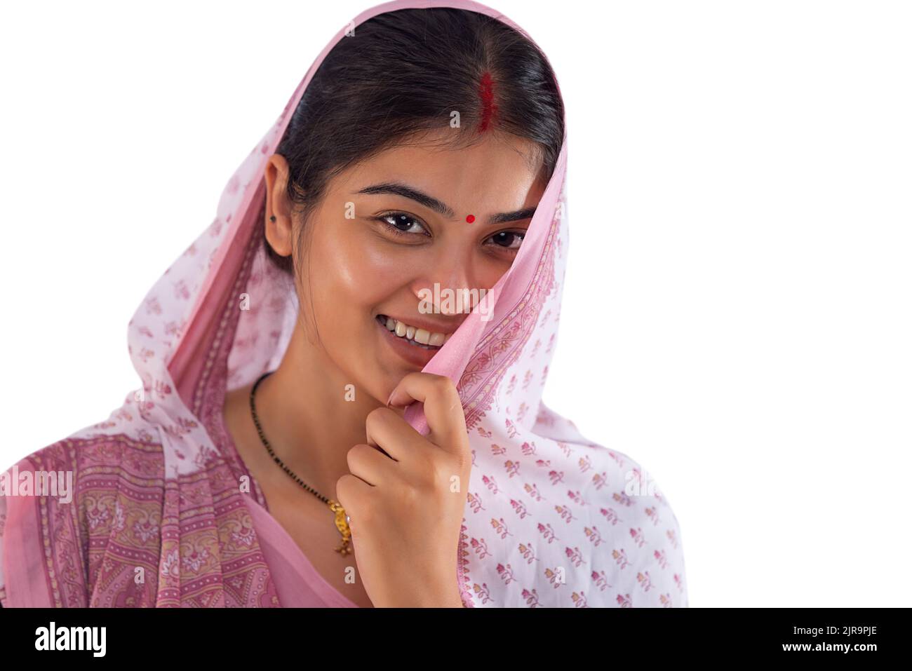 Close-up portrait of a smiling Bihar woman against white background ...