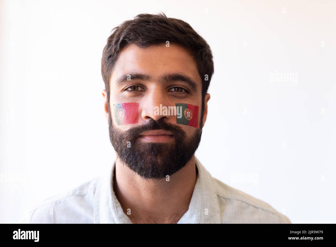 Image of serious multiracial man with flags of portugal on face Stock ...
