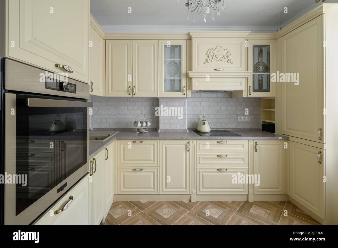 Interior of modern trendy cream colored kitchen Stock Photo - Alamy