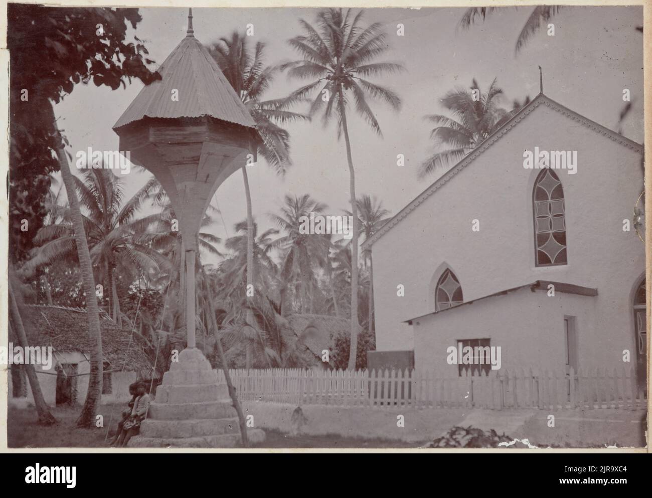 Church entrance and houses. From the album: Cook Islands, circa 1896 ...