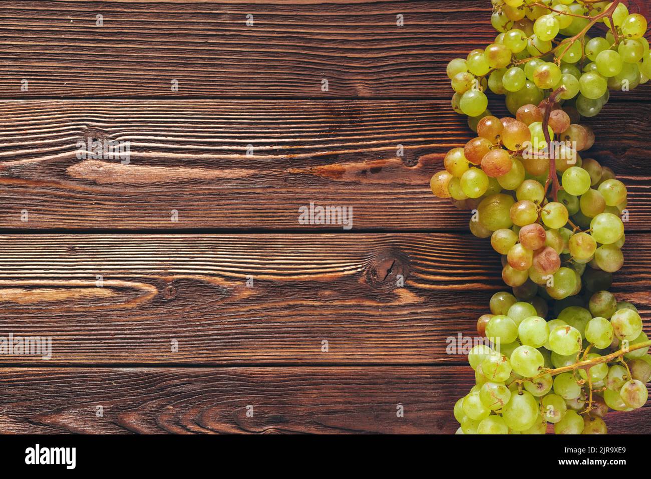Grapes on a wooden table Stock Photo - Alamy